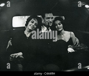 Playboy magazine publisher Hugh Hefner poses with "bunny-girl" hostess ...
