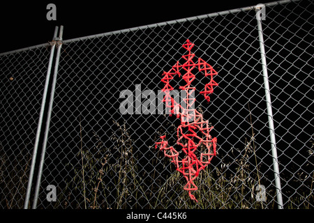 Dollar sign design on a chain link fence Stock Photo - Alamy