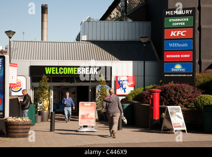Entrance to a UK motorway service station with signs for food and ...