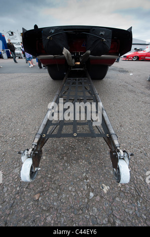Rear view of dragster showing wheelie bars and parachutes. Wide angle ...