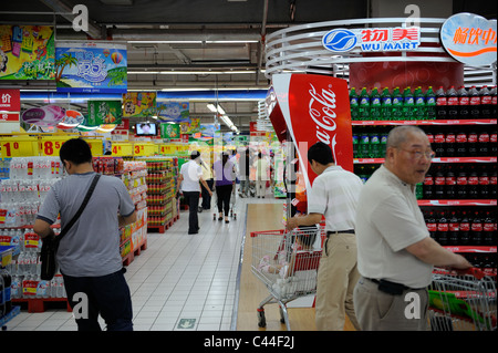 Chinese customers shopping at a Wumart supermarket in Beijing, China.28 ...