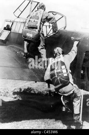 "The pilot of a Junkers Ju 87 ""Stuka"" is ""dressed"" before take-off ...