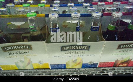 Six-packs of flavored malt beverages are seen on a grocery store shelf ...