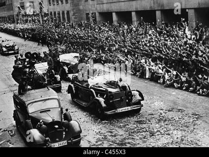 Adolf Hitler standing in his car greets the Nazi formations, Nuremberg ...