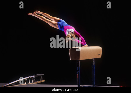 A female gymnast on the vault Stock Photo - Alamy