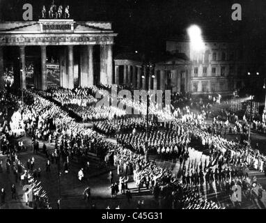 A scene of the torchlight procession of the SA at Brandenburg Gate. The ...