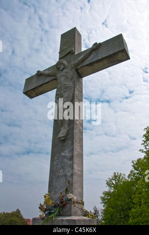 A statue of Jesus Christ crucified against unusual dramatic sky Stock Photo - Alamy