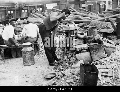 The Great Depression. An unemployed homeless man stands in the doorway ...