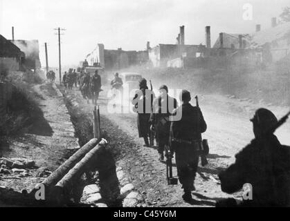 German soldiers marching through the town of Storkow, Germany. Ca. 1943 ...