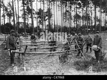 German soldiers in front of a barbed wire obstacle during the First ...