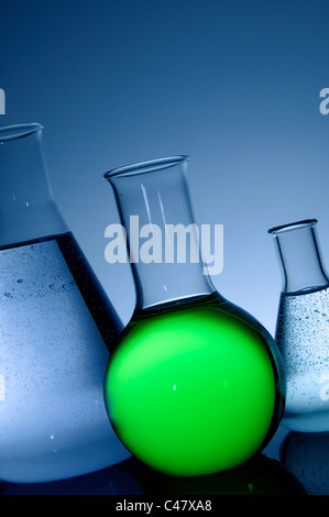 Three scientific laboratory glass erlenmeyer flask isolated on white ...