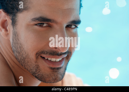 Young handsome man on holidays wearing Hawaiian shirt over white ...