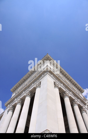 ancient white column supporting structure with blue sky in background ...