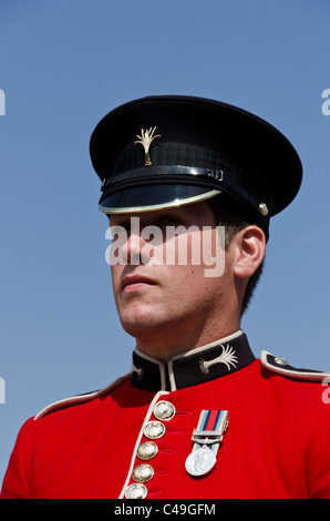 Portrait of young British soldier wearing red uniform with Trafalgar ...