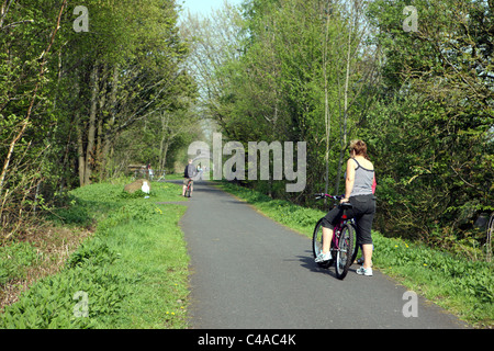Cyclists on the Paisley and Clyde Coast railway path between Johnstone ...