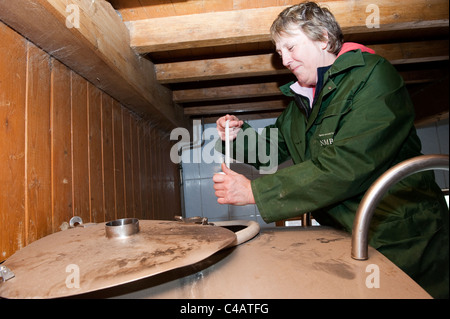 Dairy farming, National Milk Records sample tubes in farm office ...