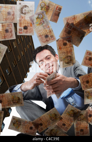 Picking up money Stock Photo - Alamy