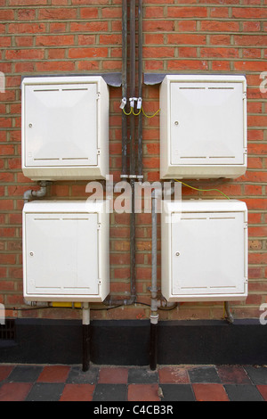 Four gas meter cupboards outside a private house Stock Photo - Alamy