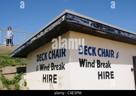A kiosk advertising windbreak and deck chair hire at Clacton in Essex ...