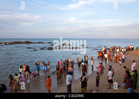 Pilgrims taking holi dip where the Bay of Bengal,Arabian sea and Indian ...