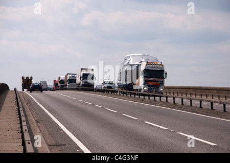 Wide load lorry carrying boat Stock Photo - Alamy