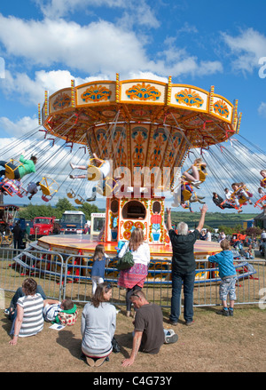 Old fashioned steam-powered carousel in operation at Beamish Open Air ...
