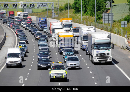 Rolling road block with a Highways Agency vehicle leading motorcycles ...