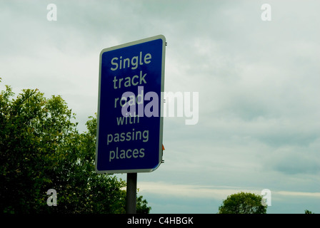 Single track road with passing places road sign Stock Photo - Alamy