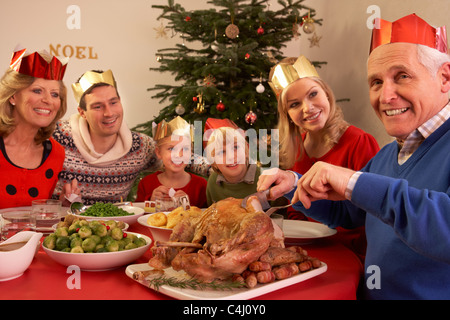 Three Generation Family Enjoying Christmas Meal At Home Stock Photo - Alamy