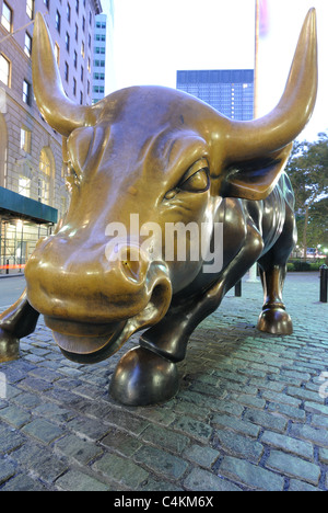 Sculpture of Charging Bull downtown Broadway covered with snow during ...