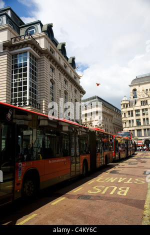 A long queue of red buses on Waterloo bridge, City of London, United ...
