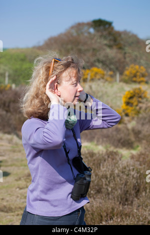 Listening to the birds Stock Photo - Alamy