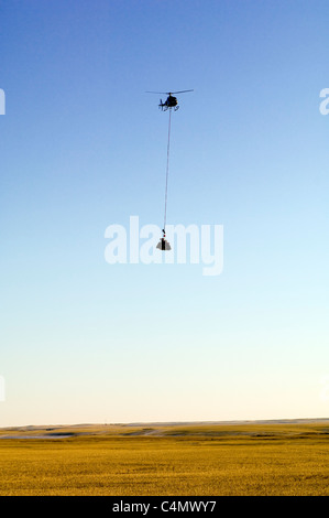 Helicopter lifting seismic cables for oil & natural gas exploration ...