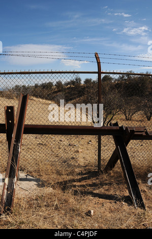 Holes cut in the fence at the Mexican border between Sonora and Lochiel ...