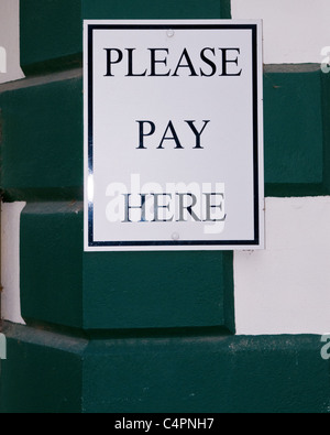 please pay here sign Stock Photo - Alamy