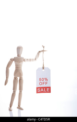 wooden doll holding sale tags Stock Photo - Alamy