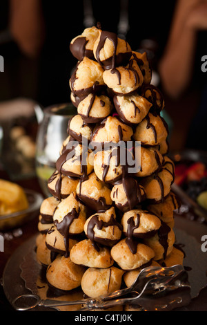 Close up shot of chocolate drizzled croissants on a wooden table Stock ...