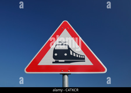 Road sign Warning Railway crossing without barrier. In Red Triangle is ...