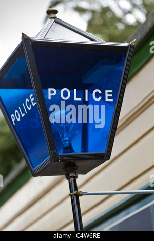 An old-fashioned blue police lamp at Shepherds Bush police station in ...