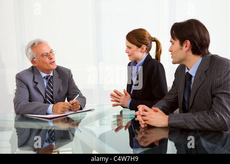 two men and one woman during a job interview Stock Photo - Alamy