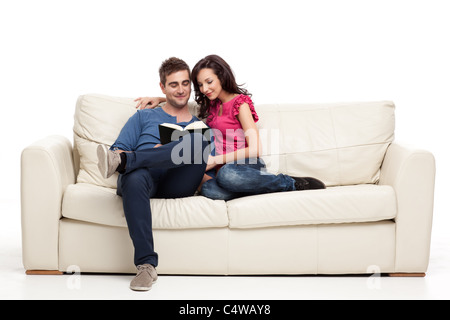 Beautiful young couple is smiling while riding a scooter Stock Photo ...