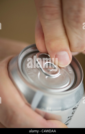 man hand opening can with soda drink Stock Photo - Alamy
