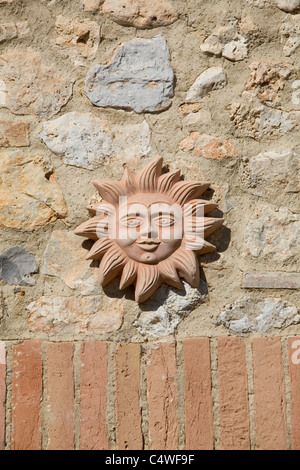 Terracotta sun design motif Rosia , Tuscany , Italy Stock Photo - Alamy
