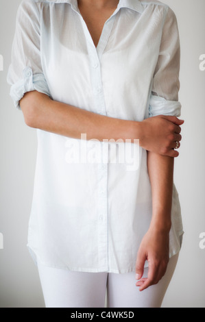 A vertical shot of the woman in a white puffer jacket against the ...