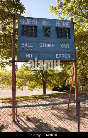 A close-up image of a red scoreboard with the words 'Home' and 'Guest ...
