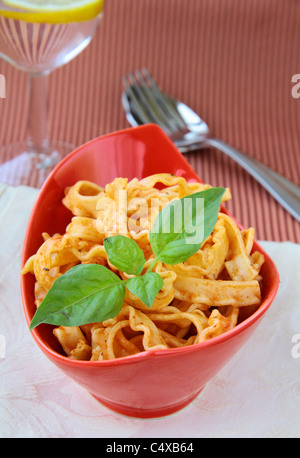 Italian pasta tripoline with tomato sauce and basil Stock Photo - Alamy