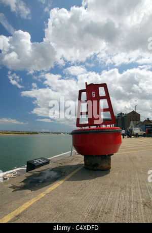 A red channel marker buoy in the Port of Tees with solar powered ...