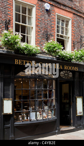 The famous Betty's Tea Rooms, York, England. A yellow bike in front ...