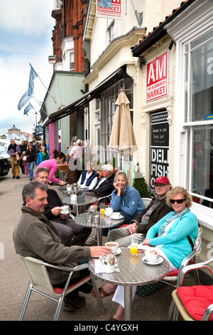 Aldeburgh Suffolk Aldeburgh High street with people browsing many shops ...