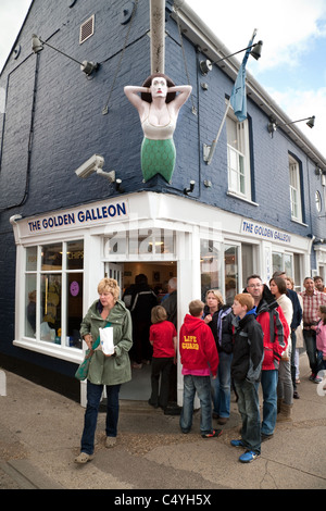 People queue outside The Golden Galleon fish and chip shop at Aldeburgh ...